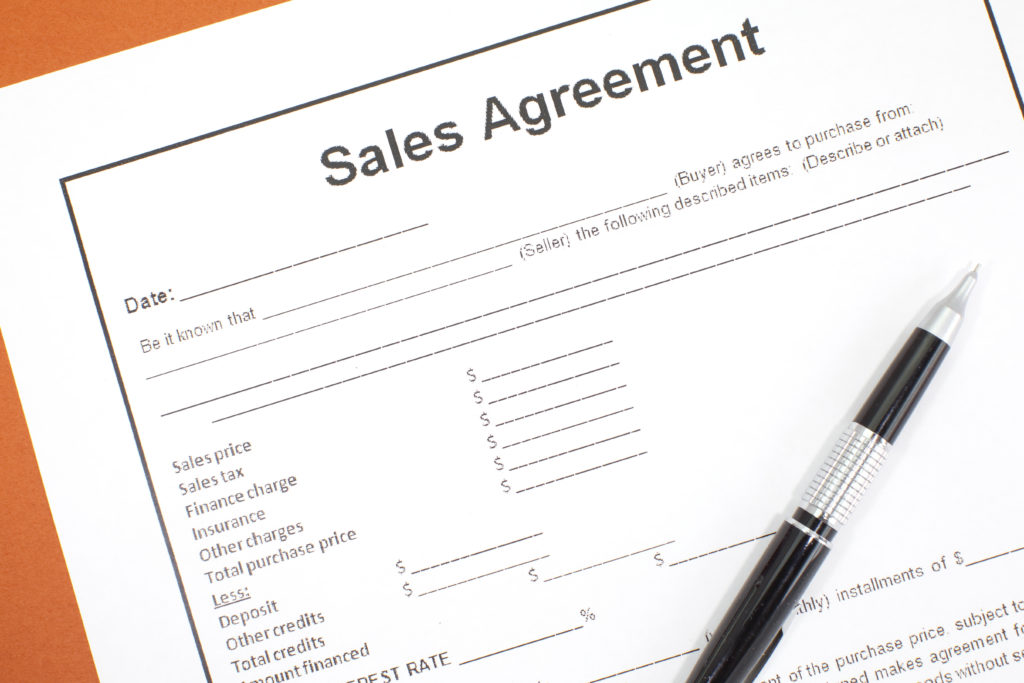 What happens after I sign the sales agreement?